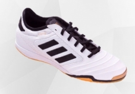 Futsal boots and goalkeeper gloves in a futsal specialized store ...